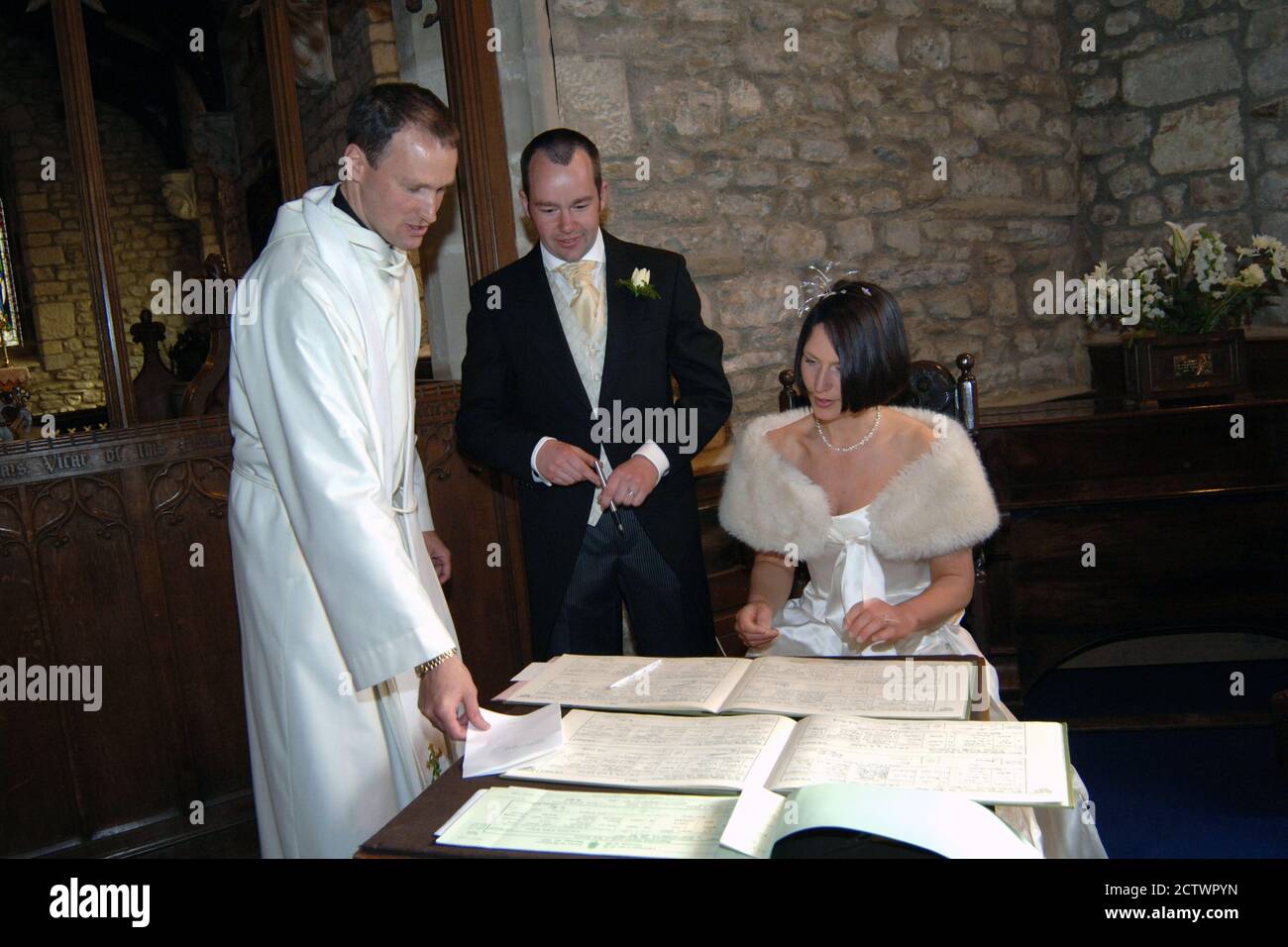 Signing the register; church wedding UK Stock Photo - Alamy