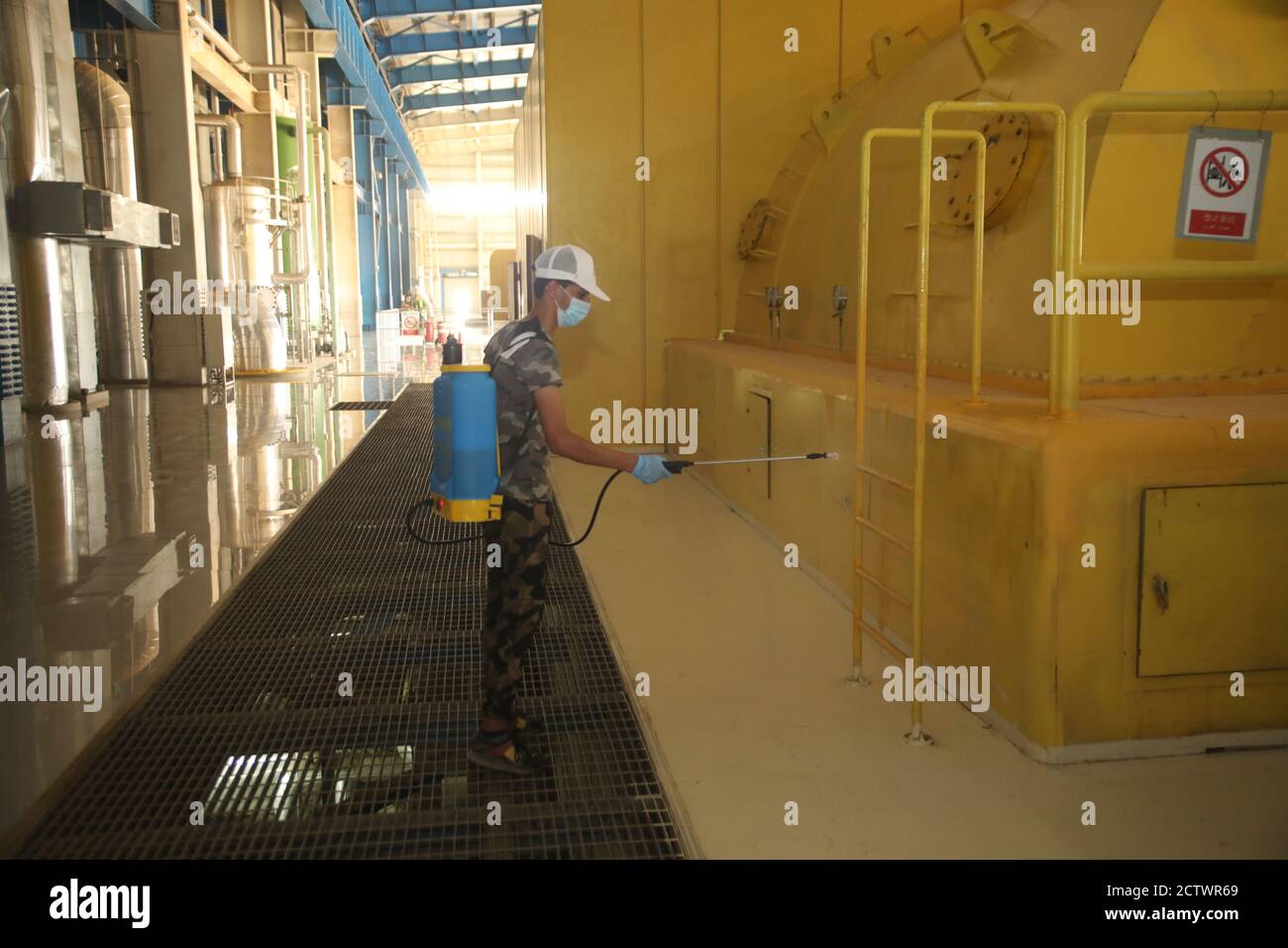 Baghdad. 25th Sep, 2020. An Iraqi employee disinfects equipments inside ...