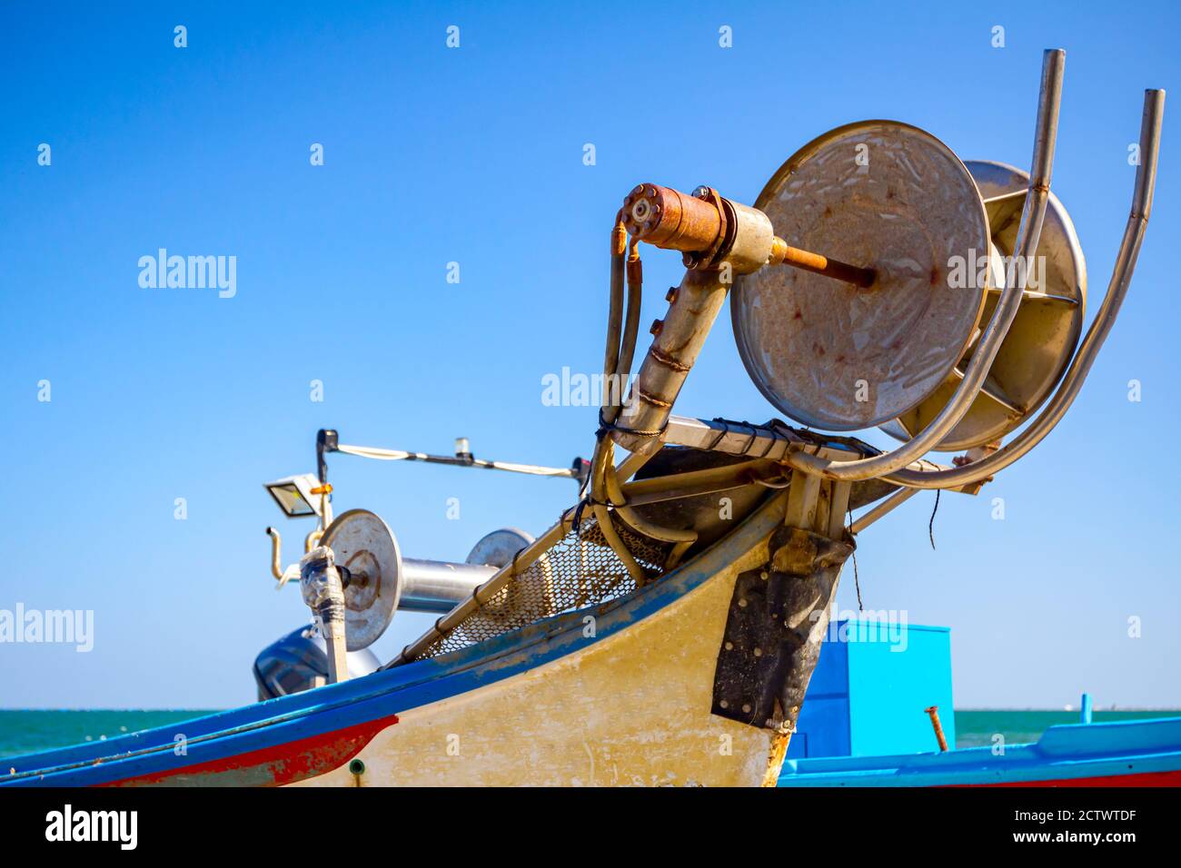 Close up shot of extraction fishing net mechanism on the fishing boat ...