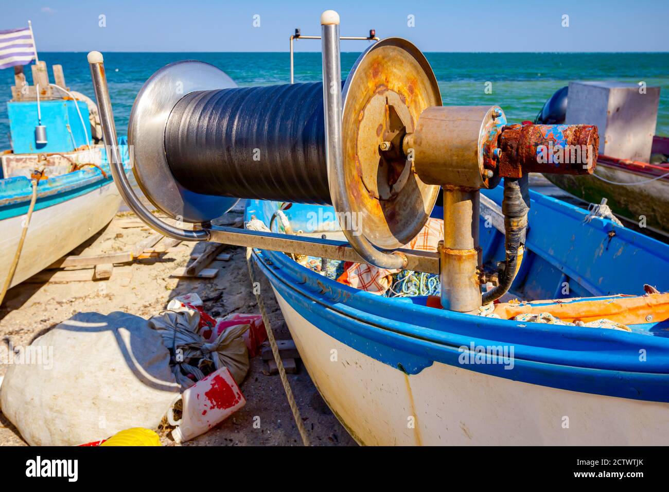 Close up shot of extraction fishing net mechanism on the fishing boat ...