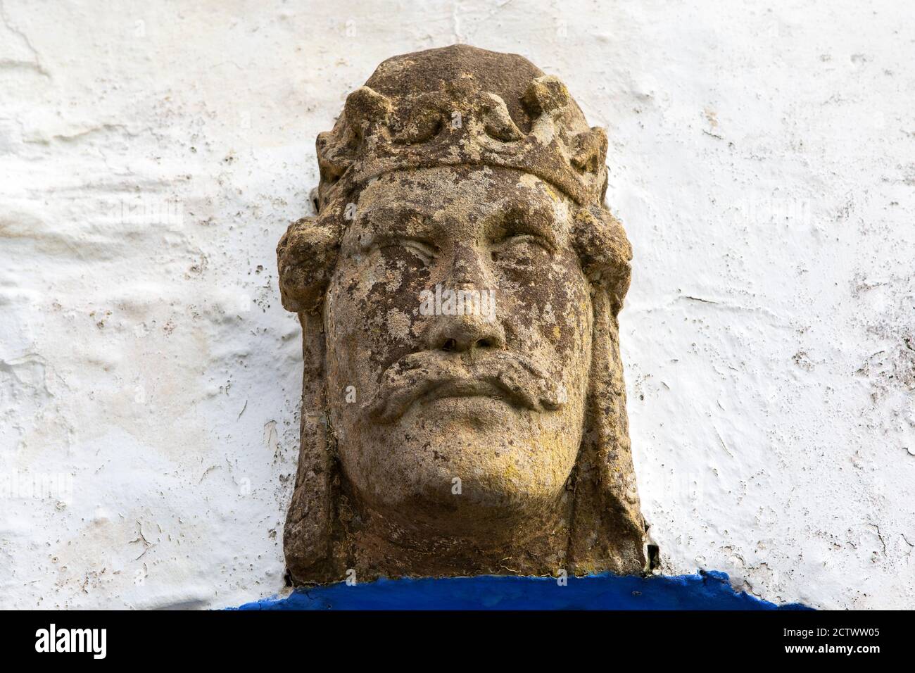 Close-up of a sculpture above an entrance to the shell grotto below the ...