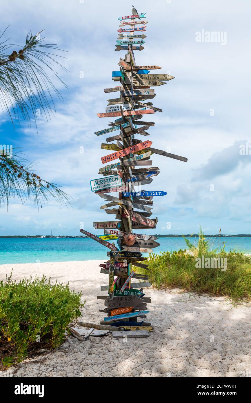 View of the tropical beach of Stock Island with direction signs (Exuma ...