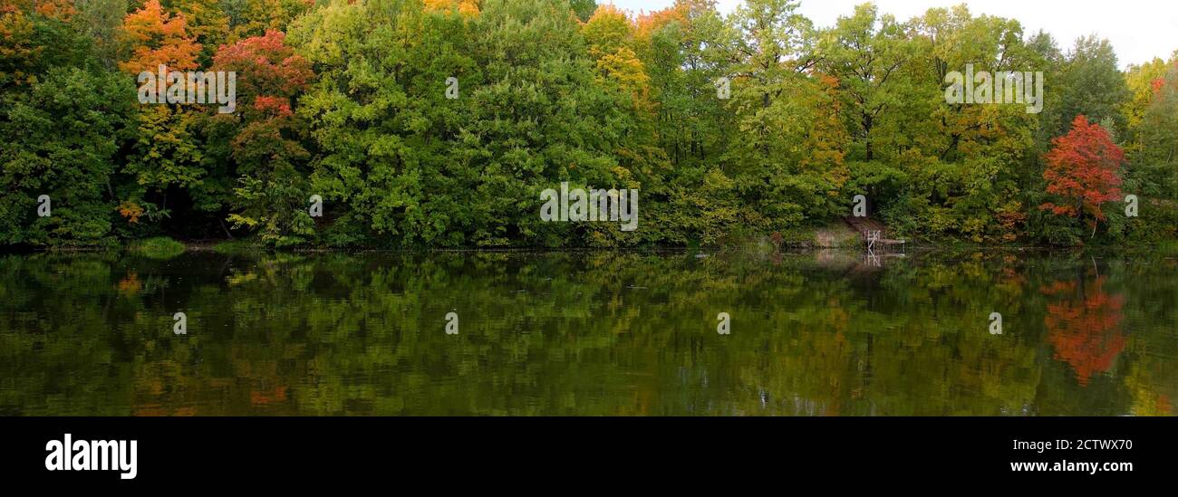Evening lakeside landscape with autumn colorful trees Stock Photo - Alamy