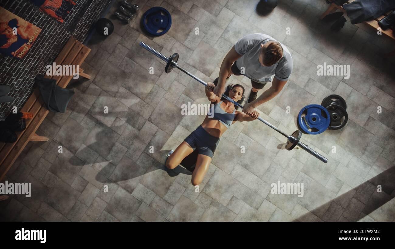 Top View of Professional Female Bodybuilder Doing Bench Press Workout ...