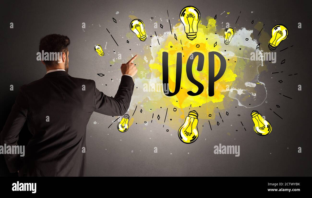 businessman drawing colorful light bulb with USP abbreviation, new ...