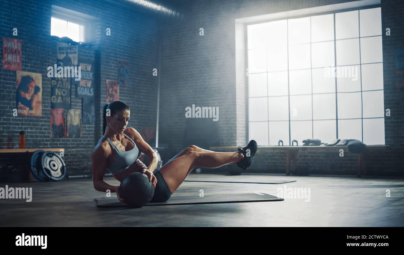 Strong and Fit Beautiful Athletic Woman in Sport Top is Doing Core and ...