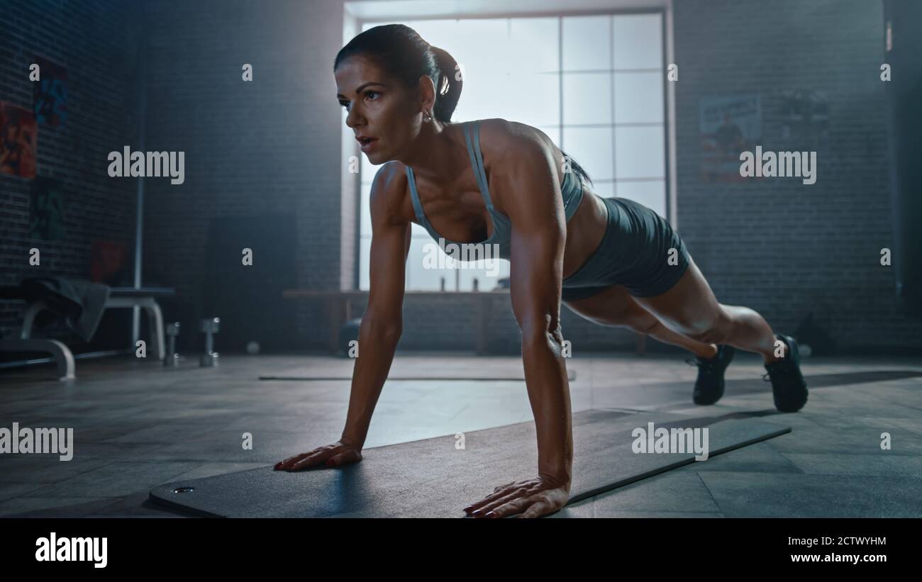Strong and Fit Athletic Woman in Sport Top and Shorts is Doing Push Up ...