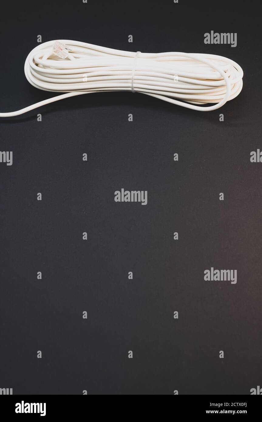 Vertical shot of an electrical extension cord isolated on black ...