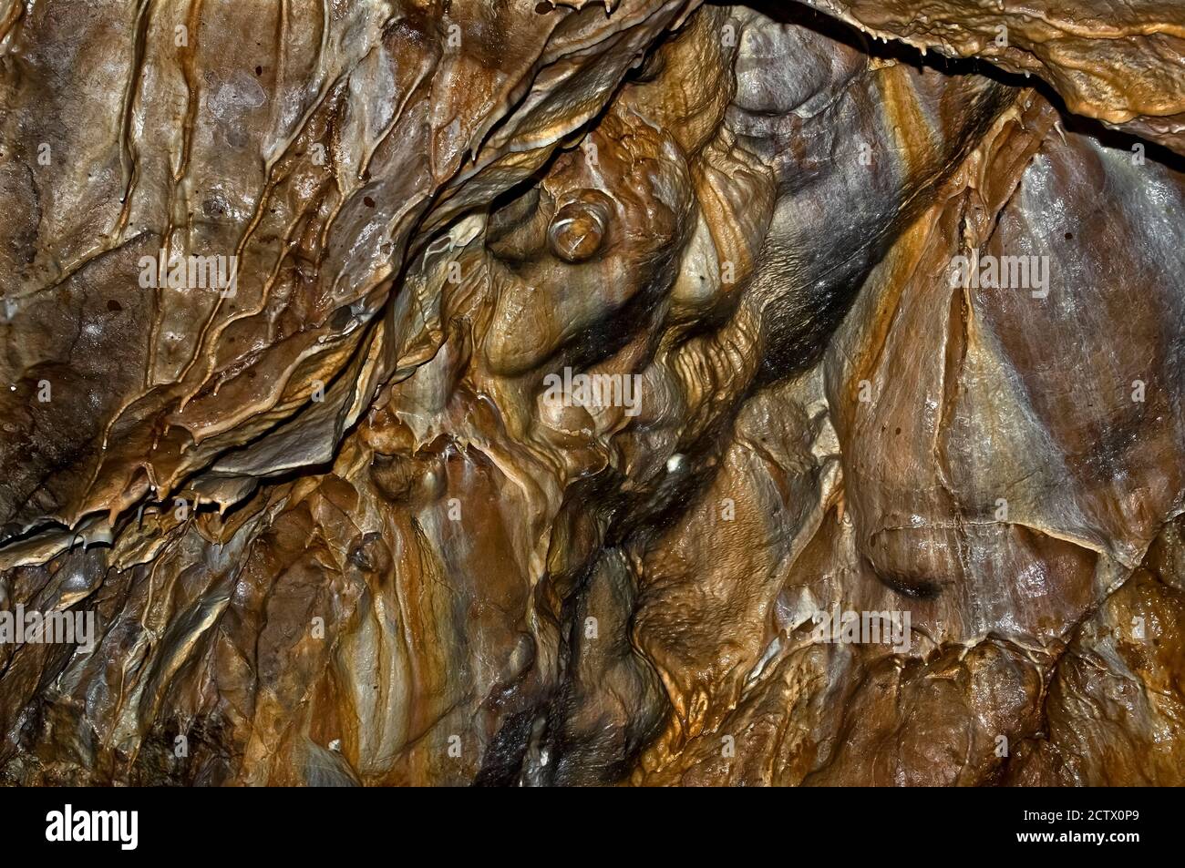 Smoothed rock formed by phreatic solution, and coated with multi ...