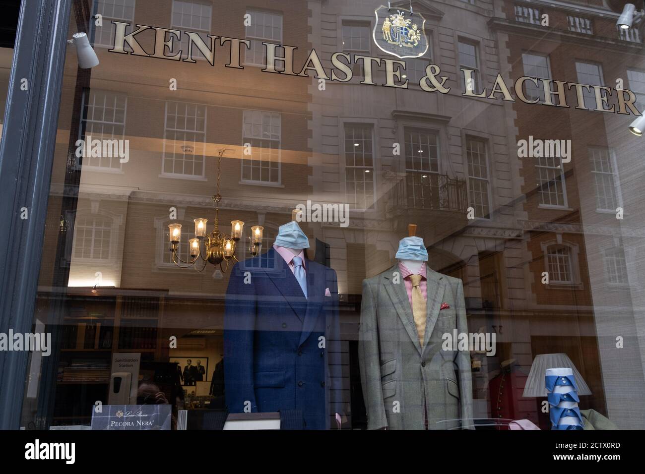 Face coverings are wrapped around the 'necks' of two tailoring dummies ...