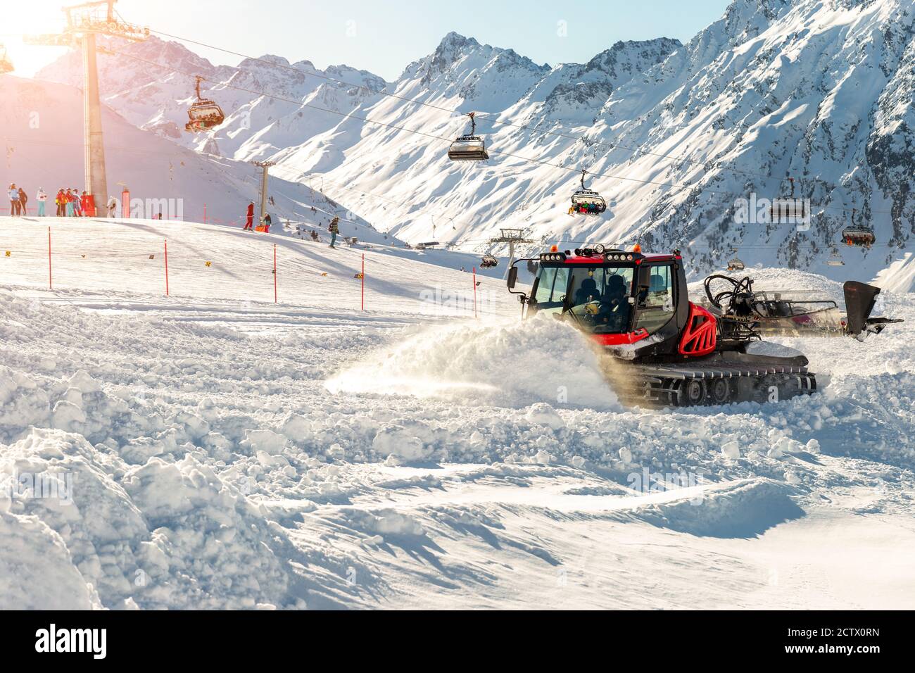 Red modern snowcat ratrack with snowplow snow grooming machine ...