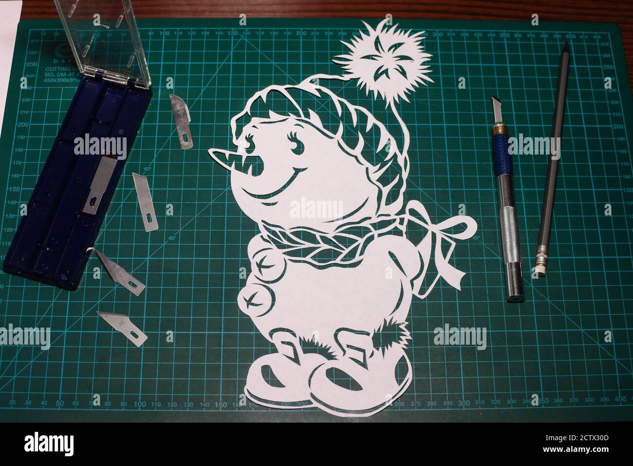 paper cutting snowman preparation for new year and christmas Stock ...