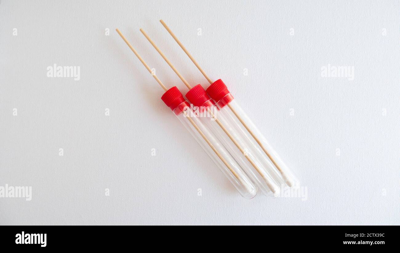 Sterile test swap tubes on white background Stock Photo - Alamy