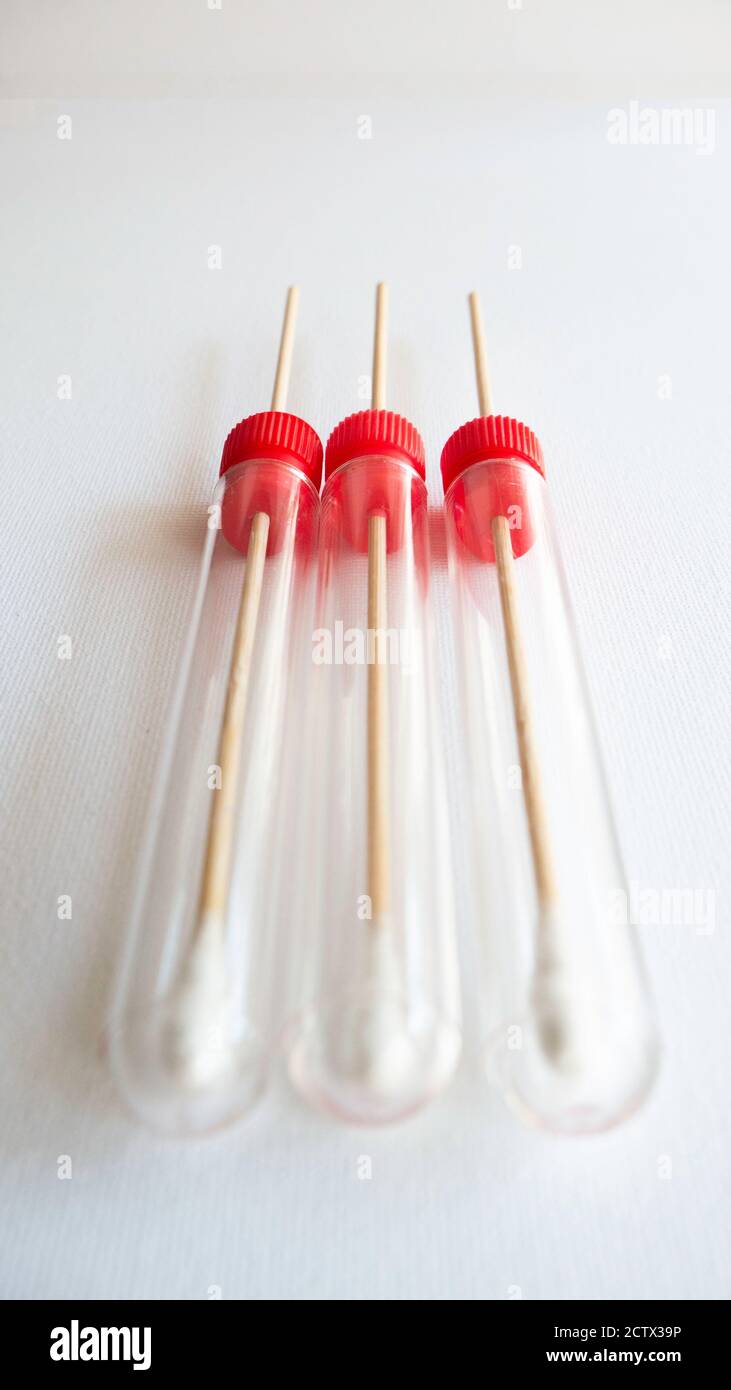 Sterile test swap tubes on white background Stock Photo - Alamy
