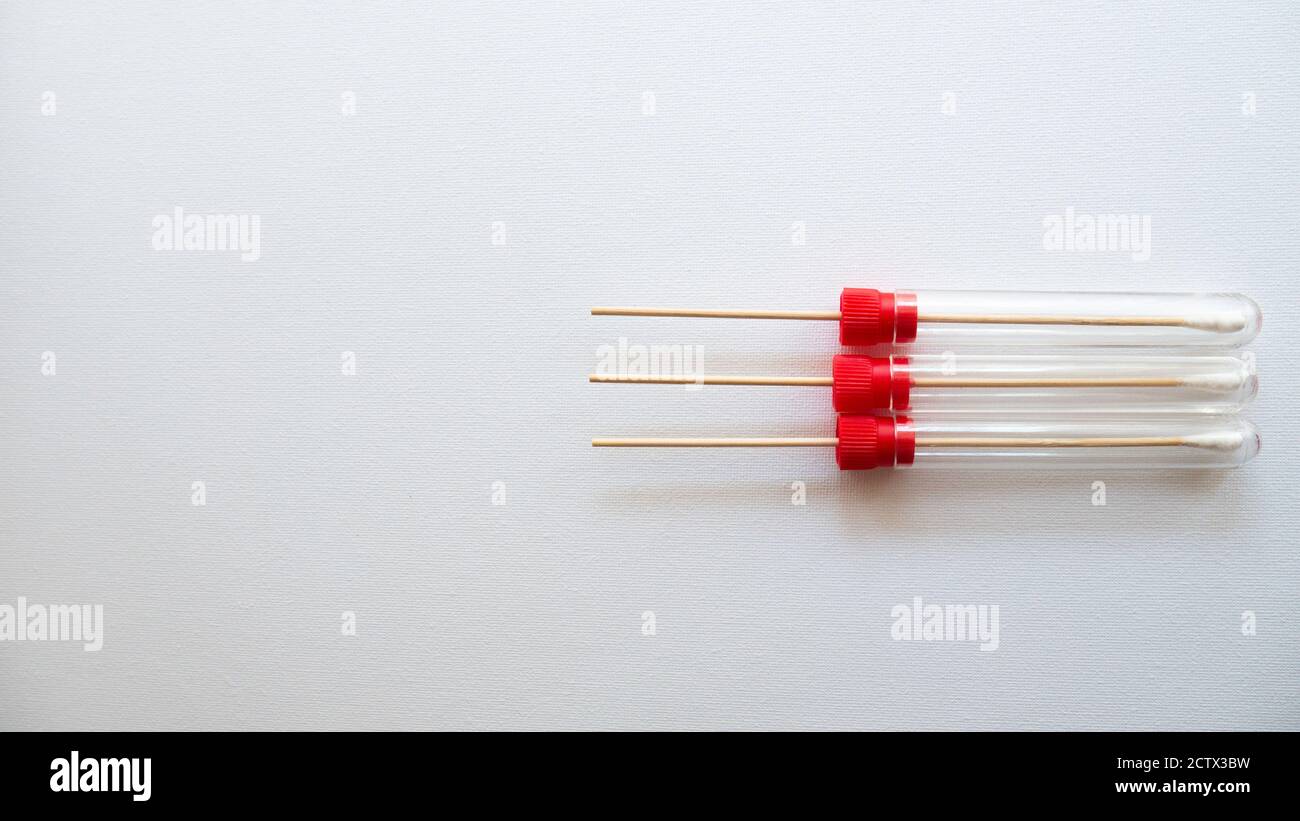 Sterile test swap tubes on white background Stock Photo - Alamy