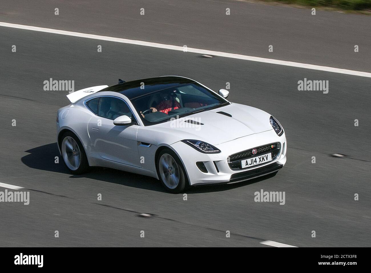 A 2014 Jaguar F-Type S V6 Auto White Car Coupe Petrol driving on the M6 ...