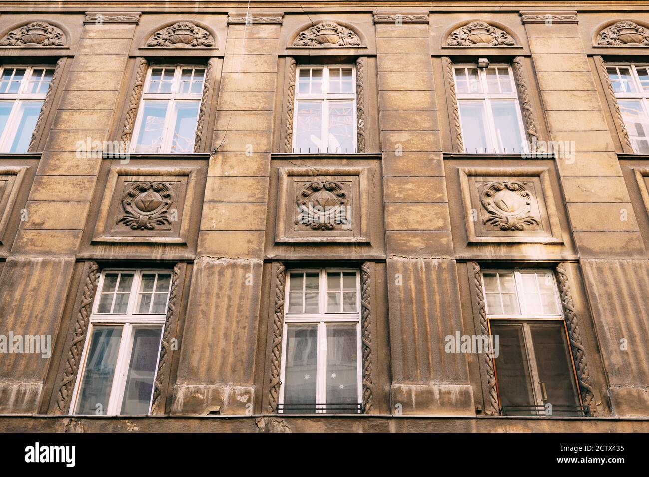 It is a tall architectural building in brown color with patterns and ...
