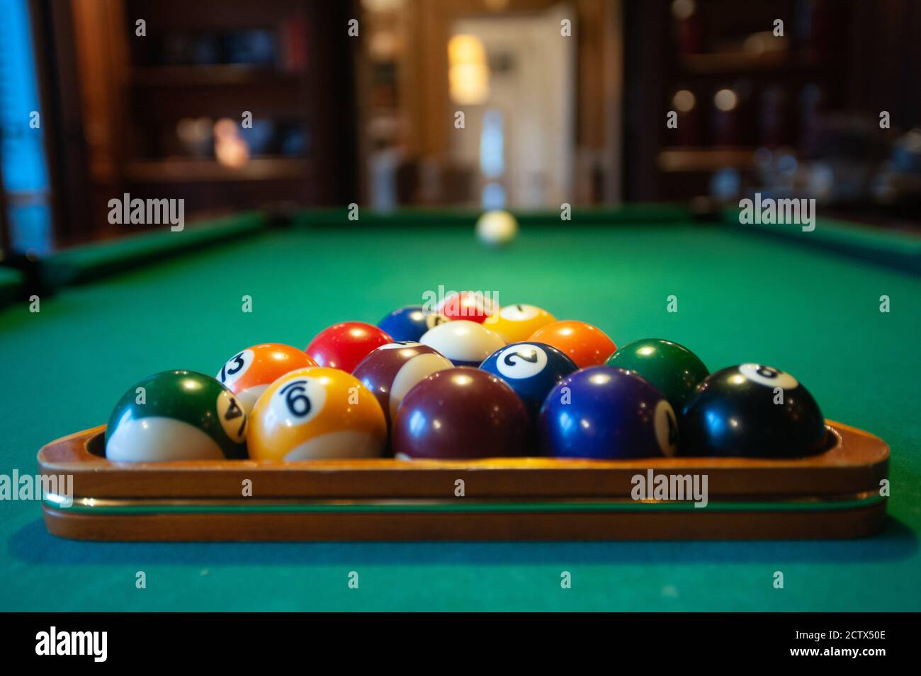 Pool balls set up on a pool table in a traditional Country House games ...