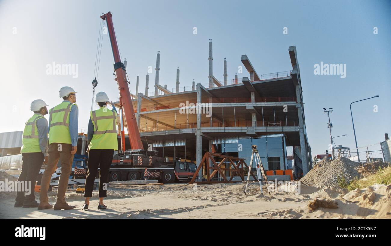 Diverse Team of Specialists Inspect Commercial, Industrial Building ...
