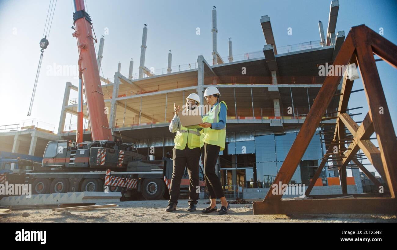 Two Specialists Inspect Commercial, Industrial Building Construction ...