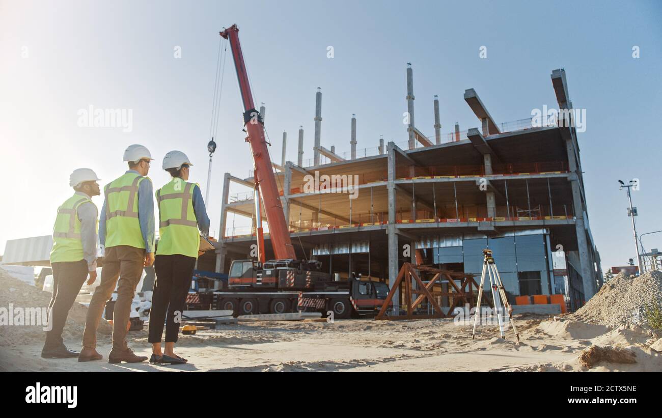 Diverse Team of Specialists Inspect Commercial, Industrial Building ...