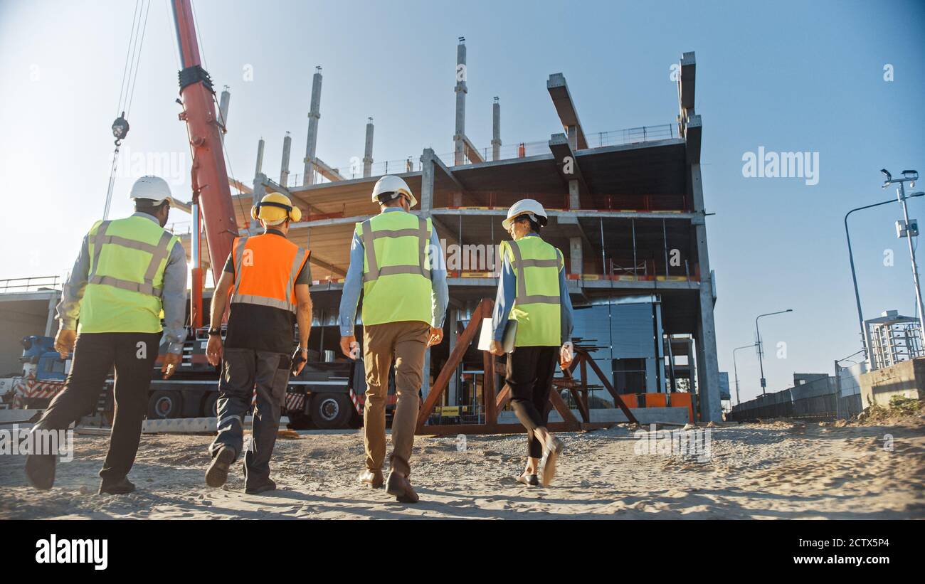 Diverse Team of Specialists Inspect Commercial, Industrial Building ...