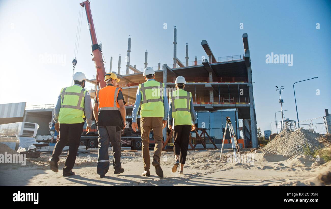 Diverse Team of Specialists Inspect Commercial, Industrial Building ...