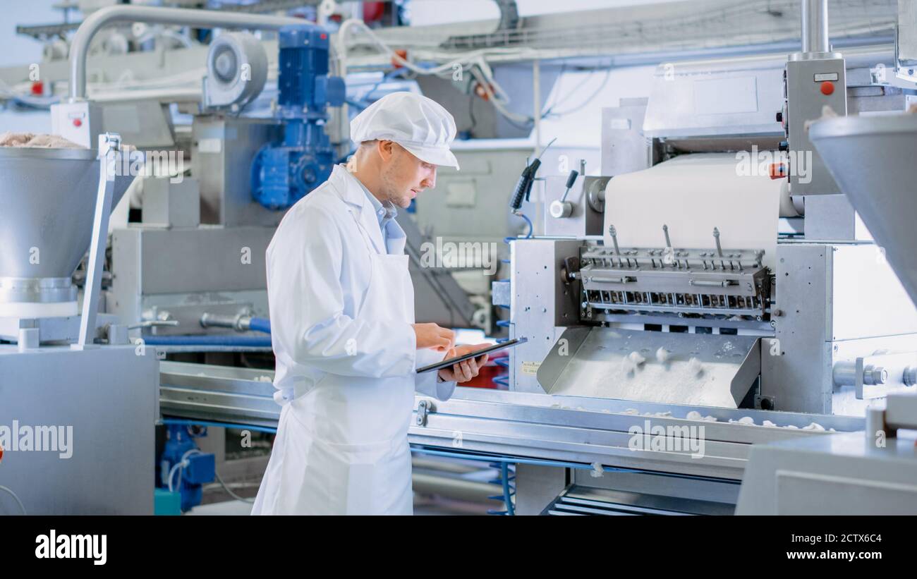 Male employee uses machine hi-res stock photography and images - Alamy