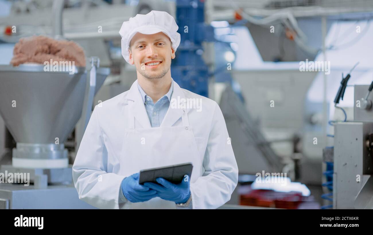 Young Male Quality Supervisor or Food Technician is Inspecting the ...
