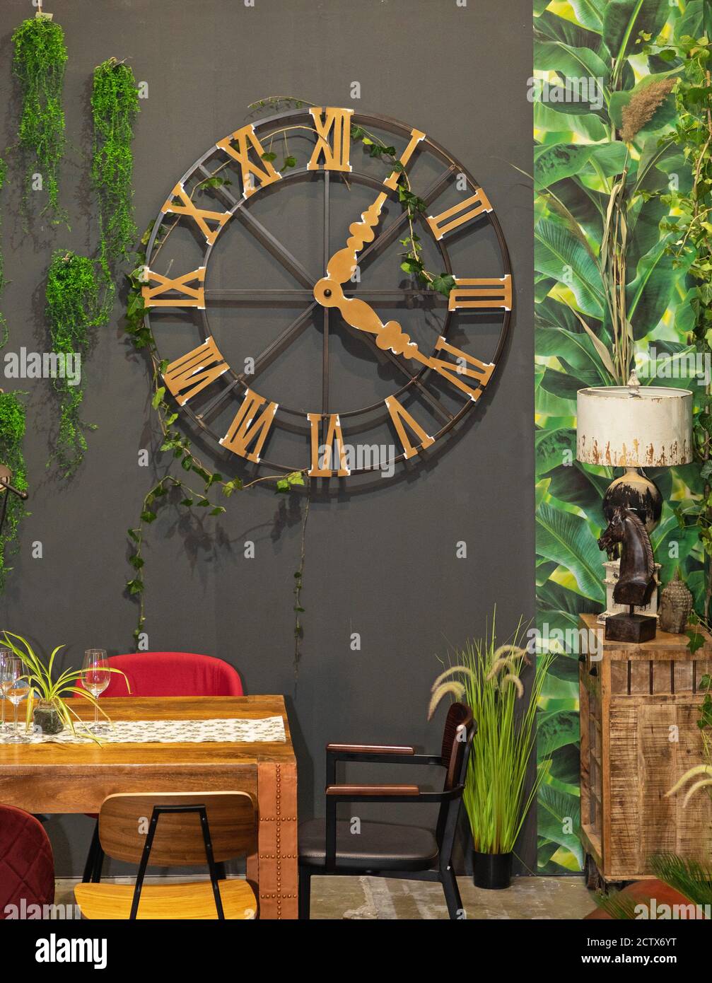 Big Round Roman Clock at Dark Wall Stock Photo - Alamy