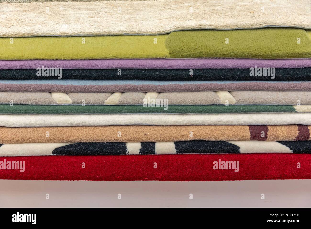 Stacked Layers of Carpets and Rugs Variety Selection Stock Photo - Alamy