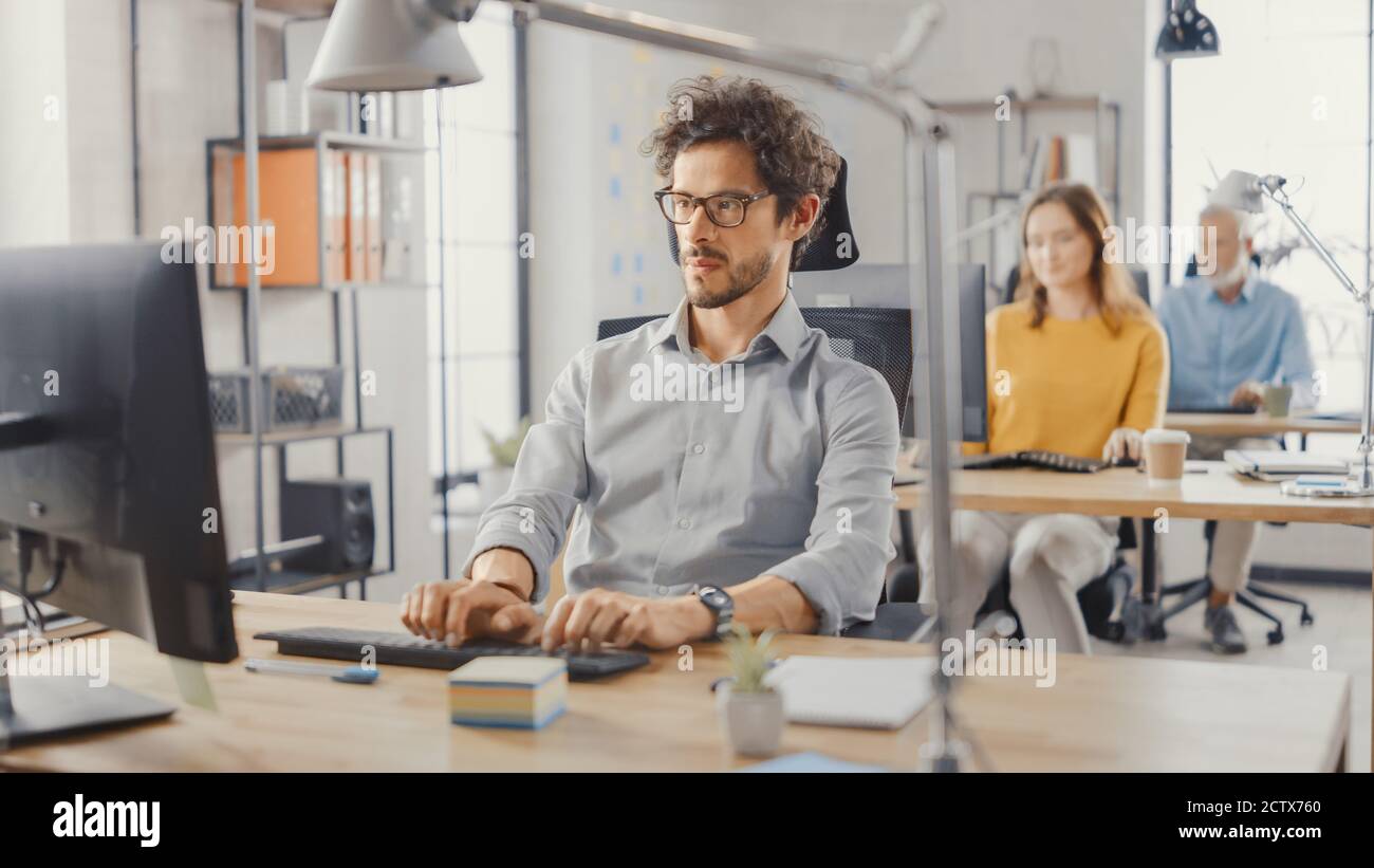 Team of Professional Office Employees Work on Desktop Computers ...