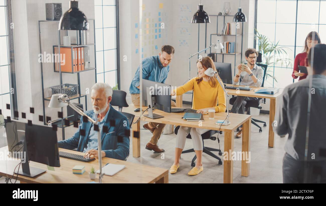 In the Busy Office: Group of Professional Businesspeople Working on ...