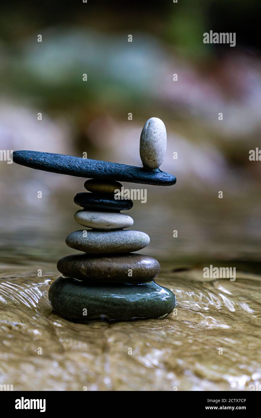 Balanced Zen stones pebbles at the waterfalls Stock Photo - Alamy