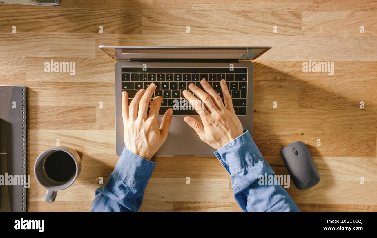 Top View Close-up Shot of a Man's Hands Typing on a Laptop Keyboard ...