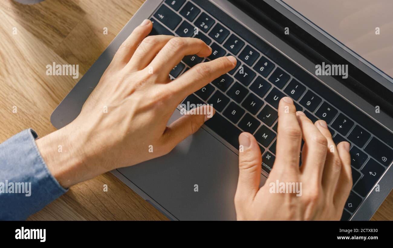 Top View Close-up Shot of a Man's Hands Typing on a Laptop Keyboard ...