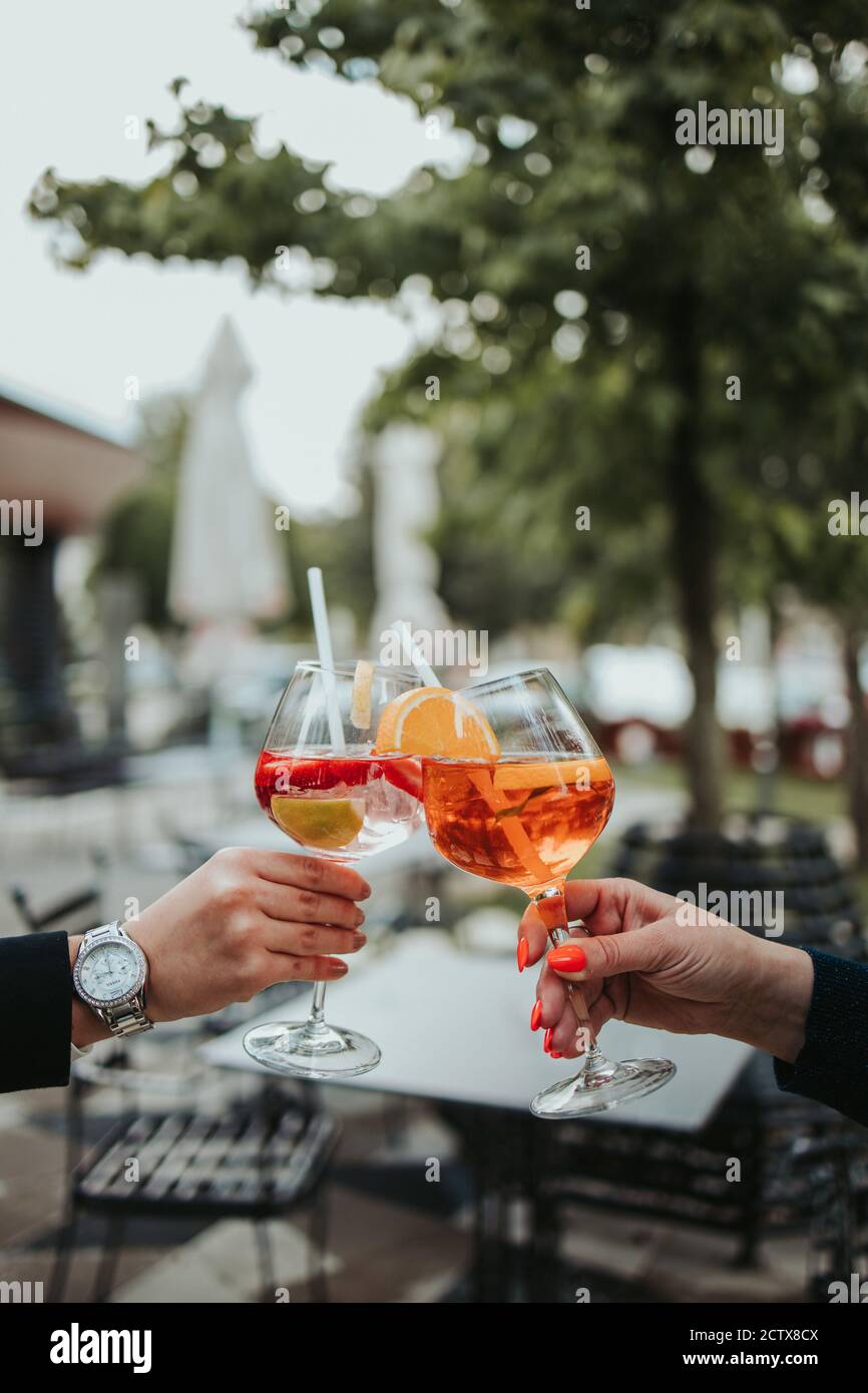 People's hands cheering with cocktails Stock Photo - Alamy