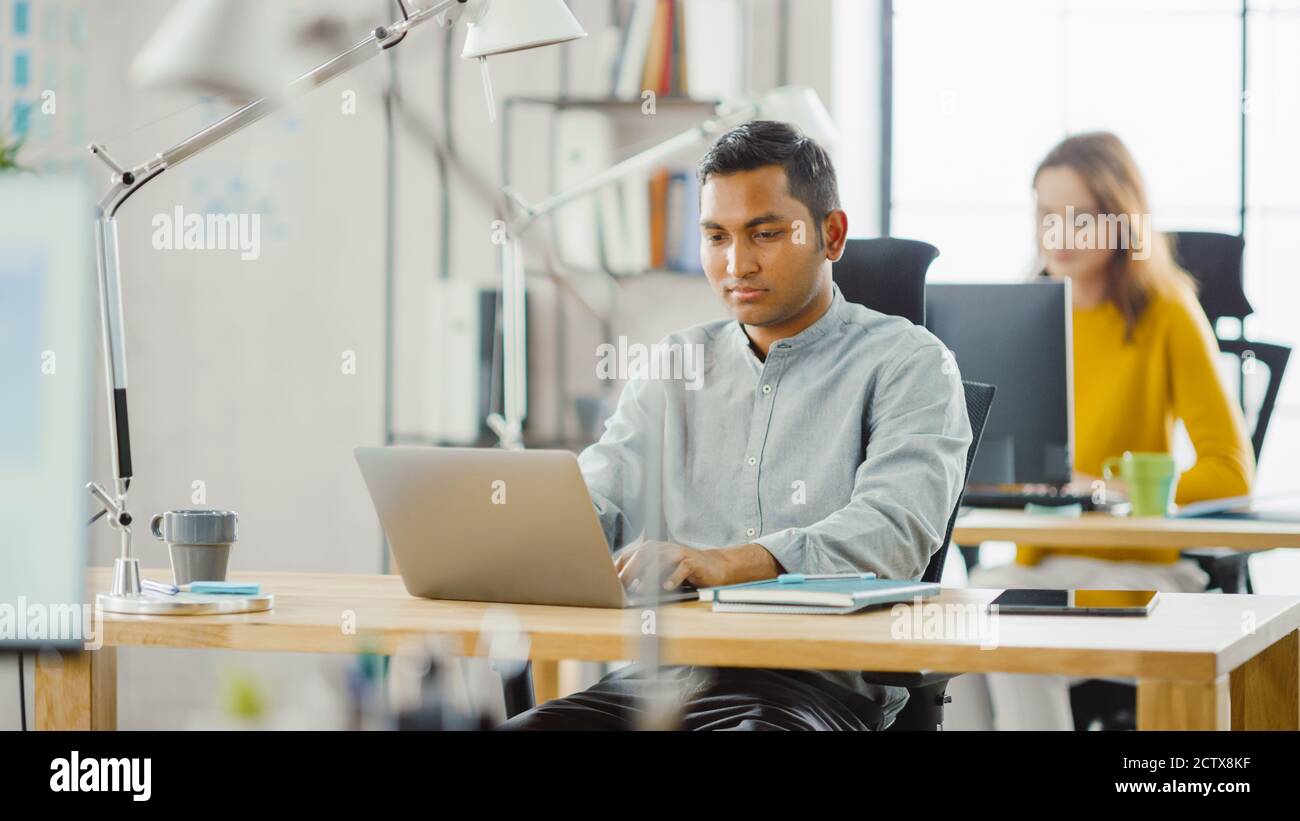 Smart and Handsome Indian Information Technology Specialist Sitting at ...