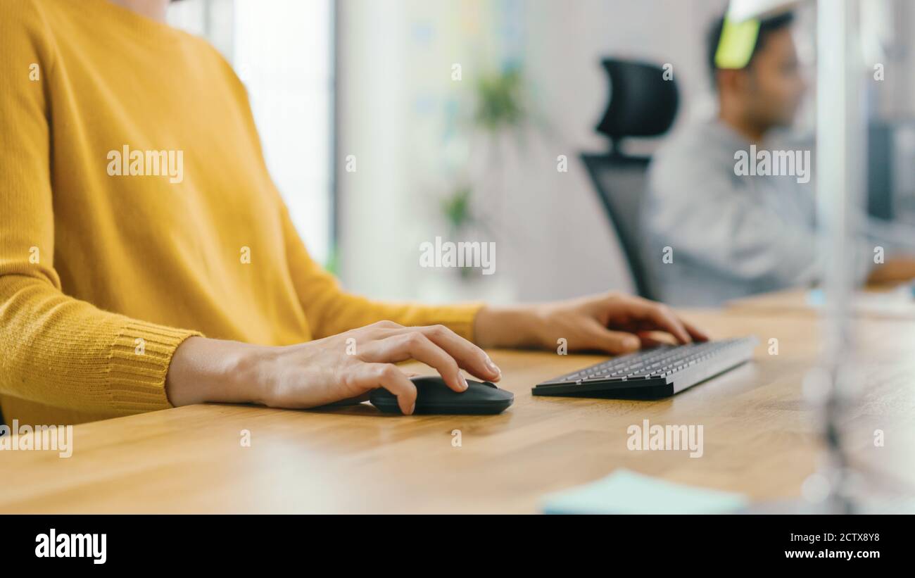 Anonymous Young Woman Sitting at Her Desk Using Laptop Computer. Focus ...