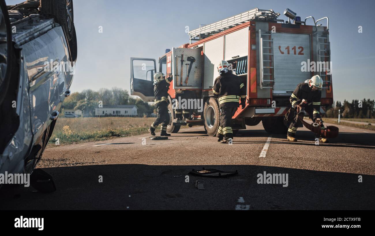 Rescue Team of Firefighters Arrive on the Car Crash Traffic Accident ...