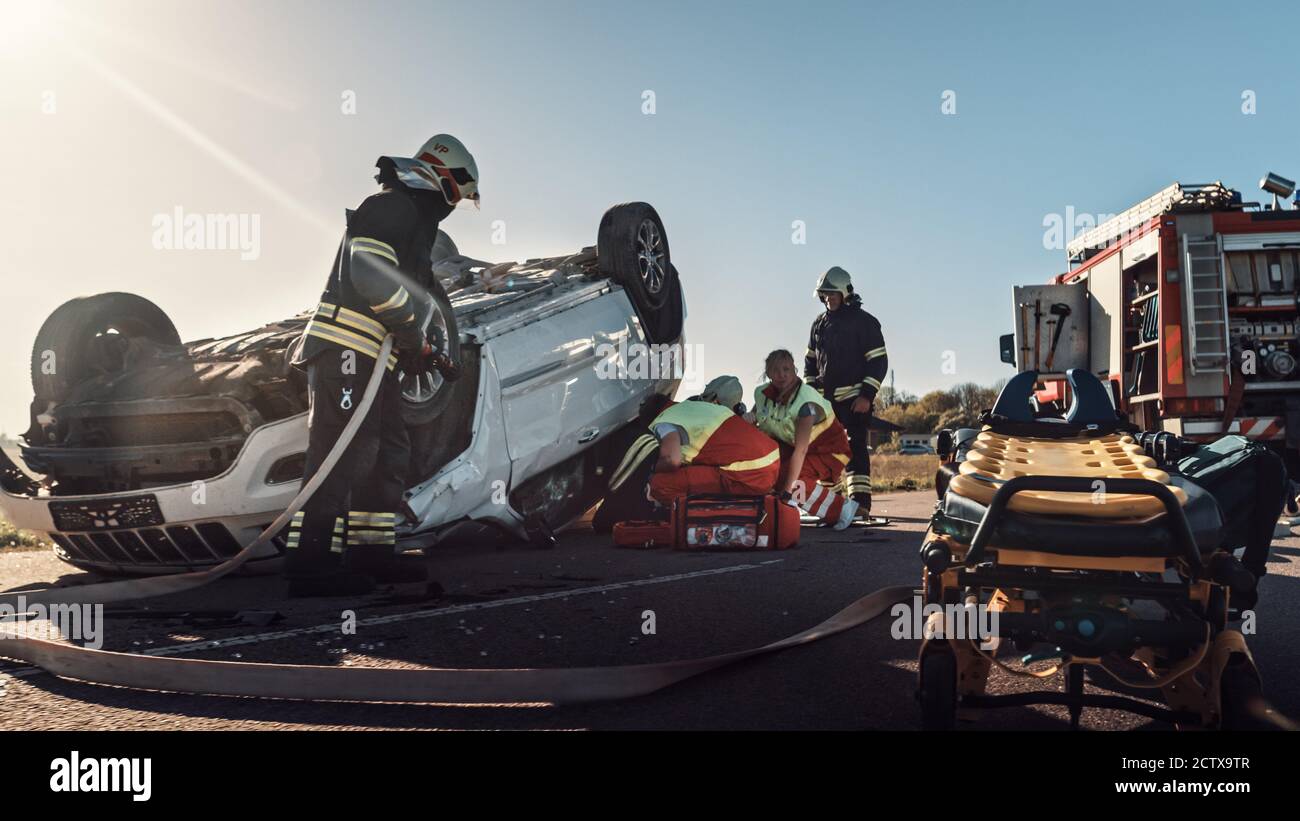 On the Car Crash Traffic Accident Scene: Team of Paramedics and ...