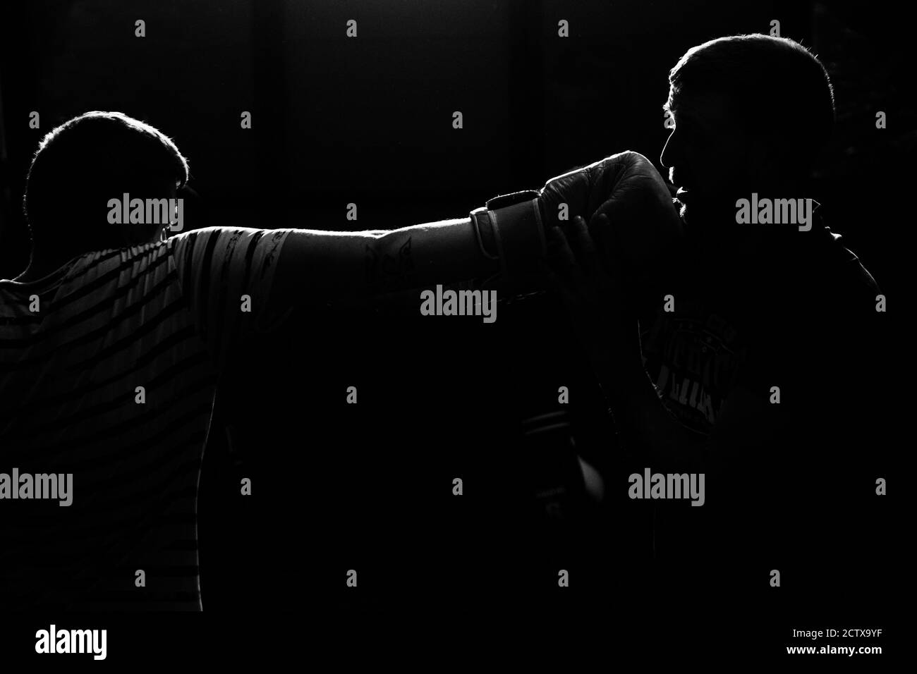 Two amateurs sportmen training boxing Stock Photo - Alamy