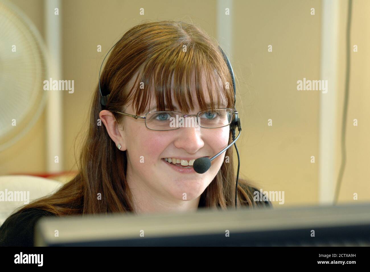 Call centre worker on the telephone; NHS Stock Photo - Alamy