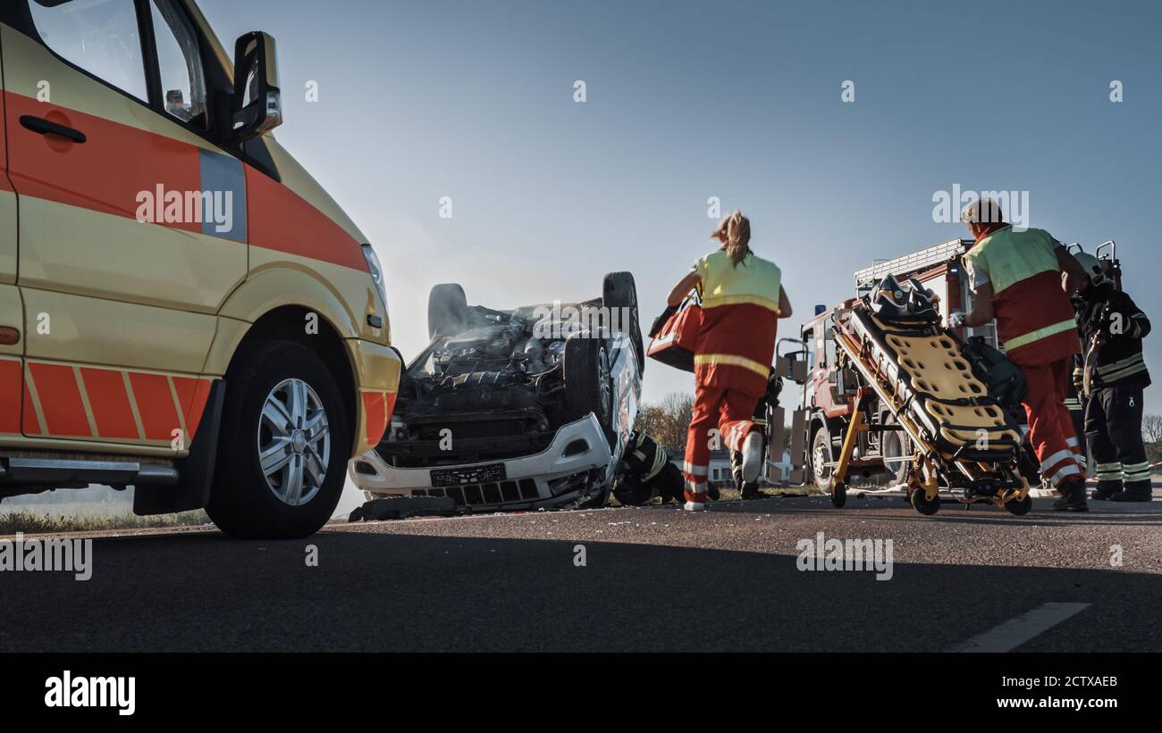 On the Car Crash Traffic Accident Scene: Team of Paramedics and ...