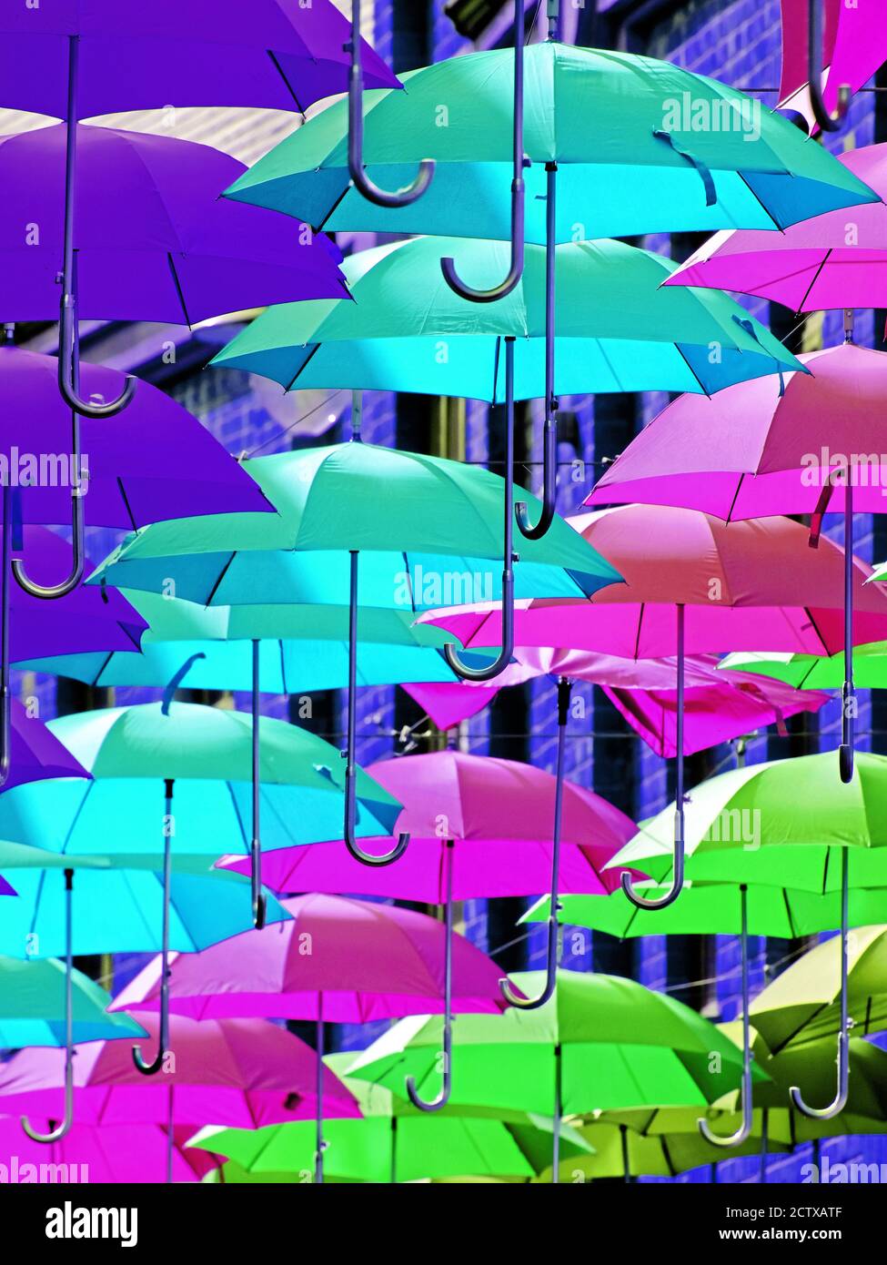 Multi coloured street decorated brollies Stock Photo - Alamy