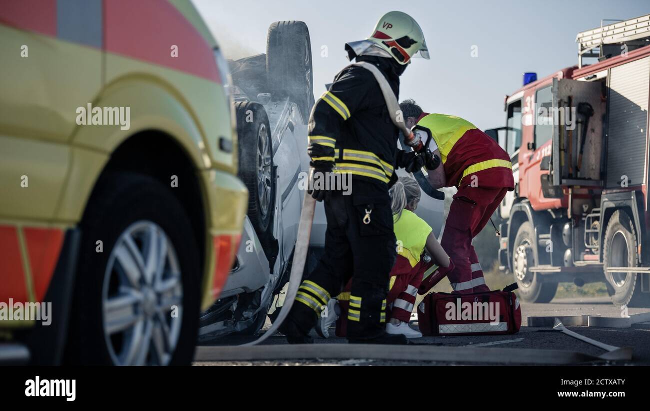 On the Car Crash Traffic Accident Scene: Paramedics and Firefighters ...