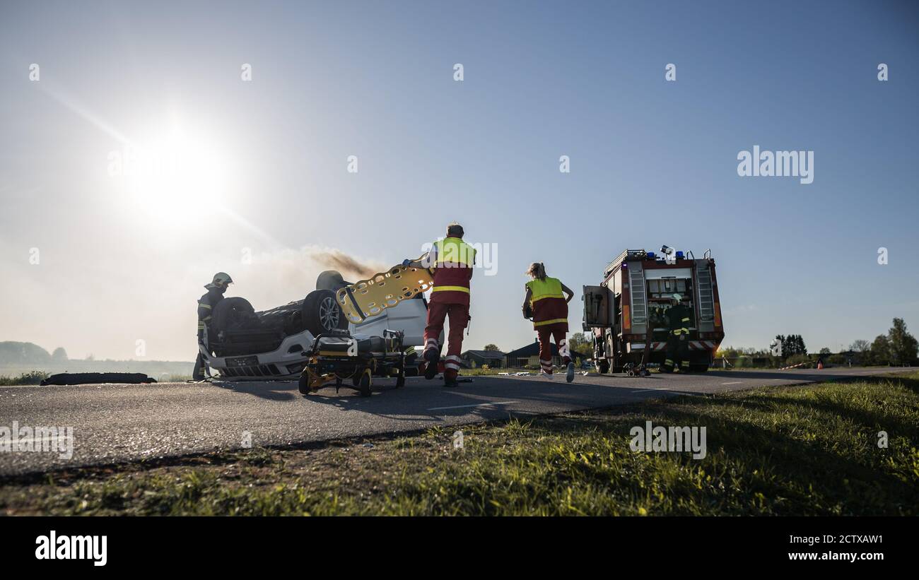 On the Car Crash Traffic Accident Scene: Team of Paramedics and ...