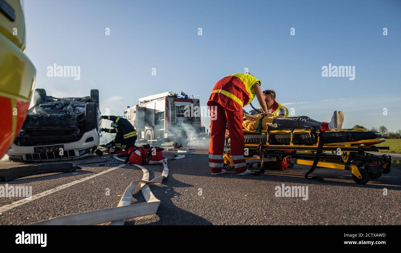 On the Car Crash Traffic Accident Scene: Paramedics Saving Life of a ...