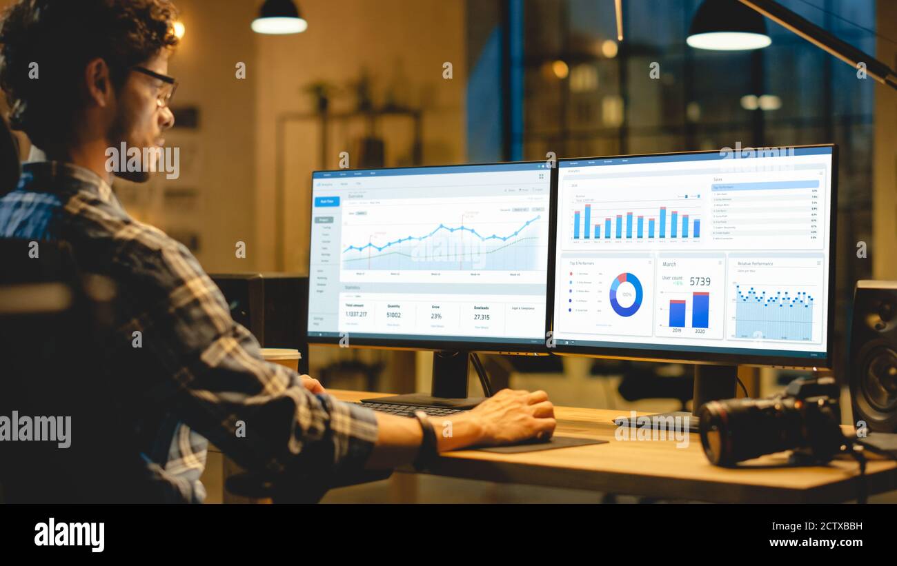 Late Evening Business Office: Professional Analyst Works on Desktop ...