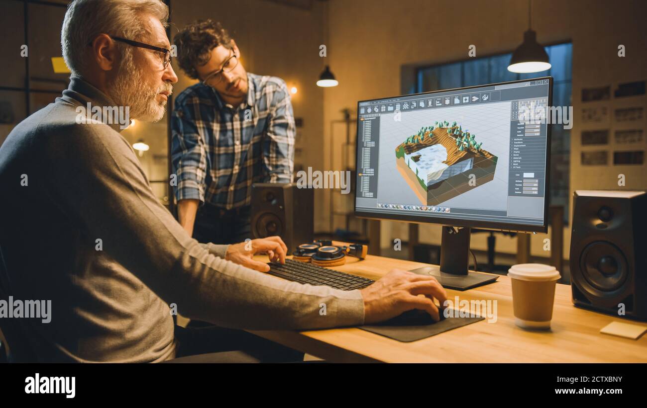 In the Evening Creative Middle Aged Video Game Developer Works on a ...